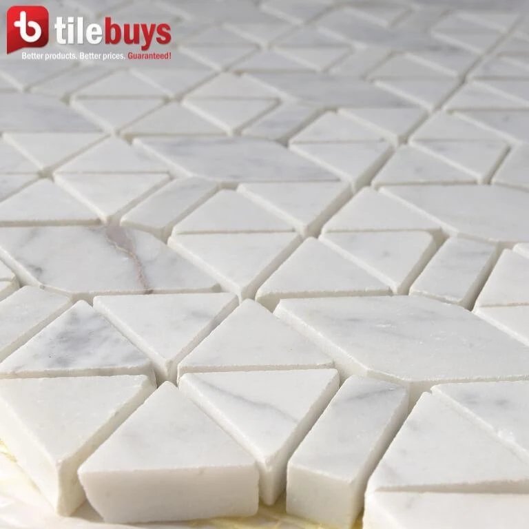 Carrara White marble mosaic tile in triangular geometric pattern.